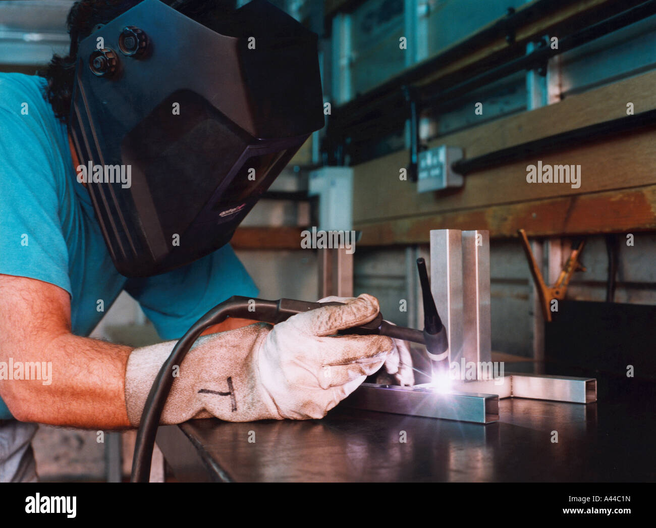 man welding steel pipe Stock Photo - Alamy