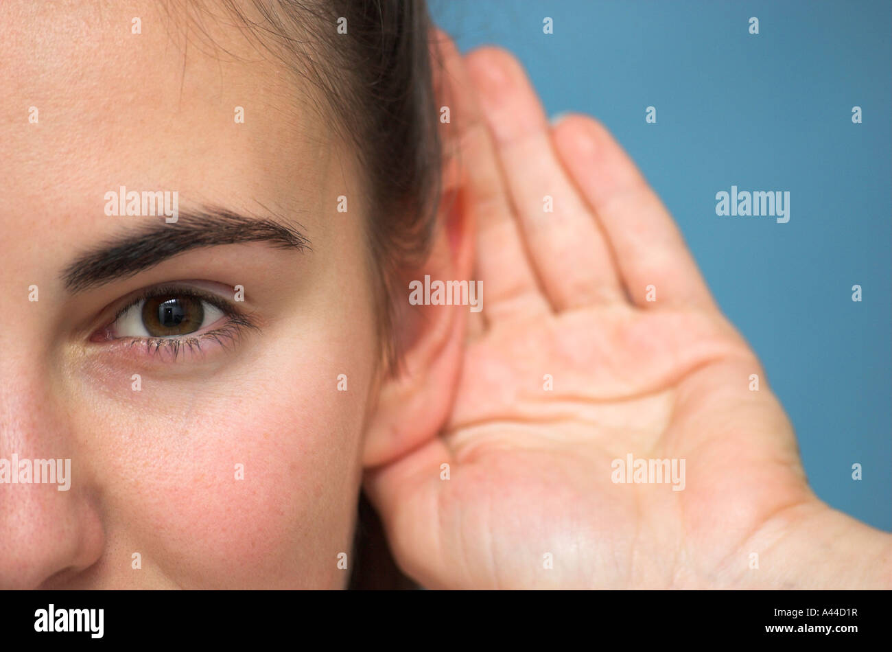 Woman cupping ears hi-res stock photography and images - Alamy
