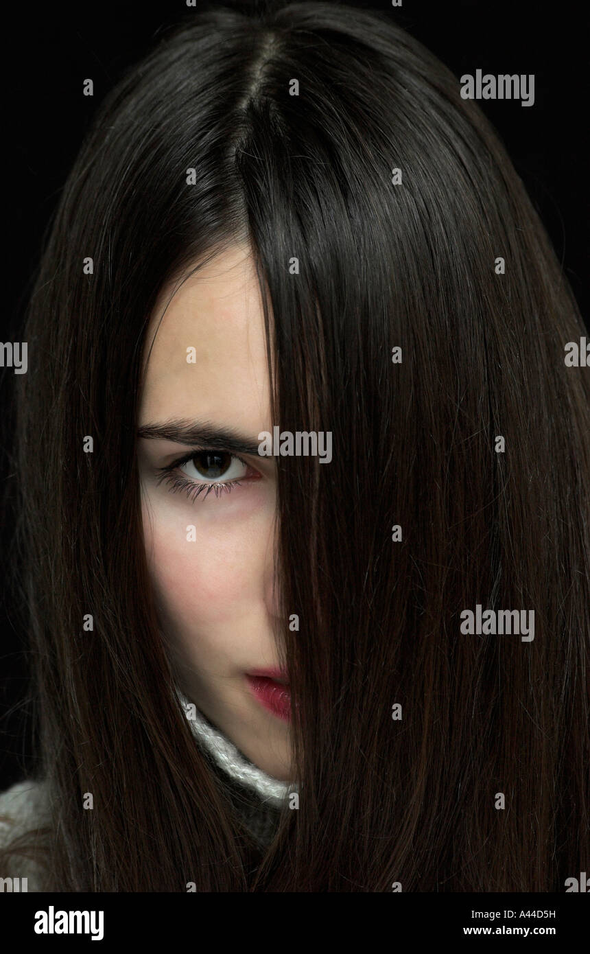 Young woman with black hair on face Stock Photo - Alamy