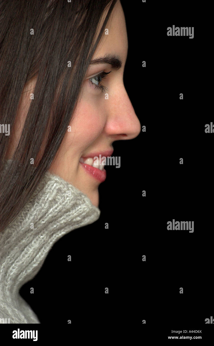 Beautiful young woman portrait side view Stock Photo - Alamy