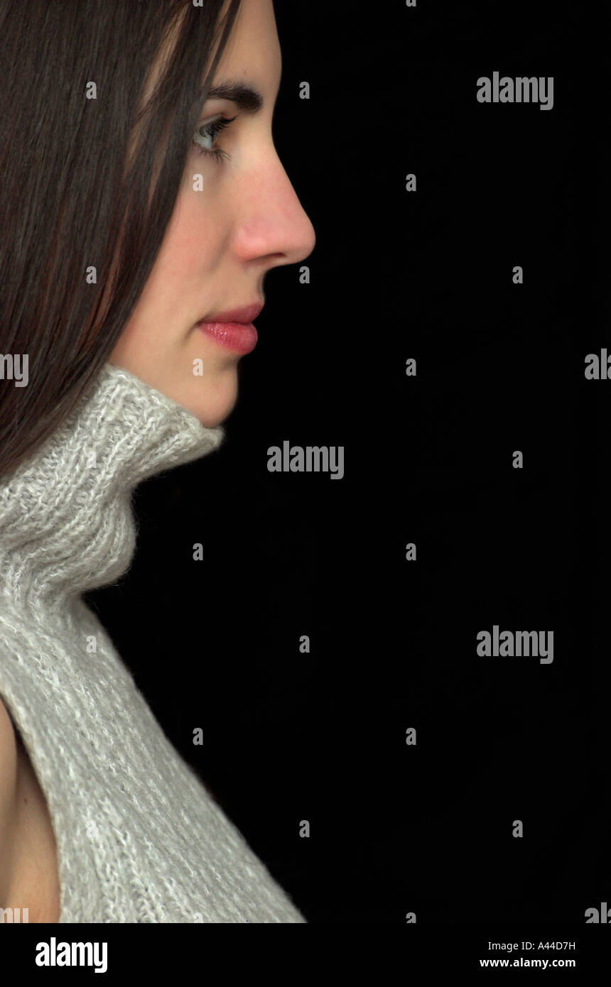 Portrait of a serious young woman side view Stock Photo - Alamy