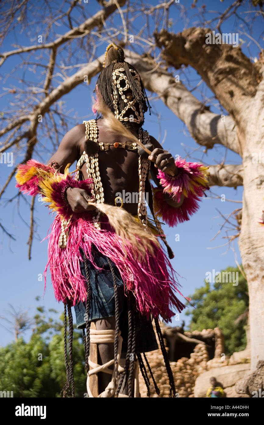 Stilt dancer at the mask dance in the village of Tereli, Dogon Country ...