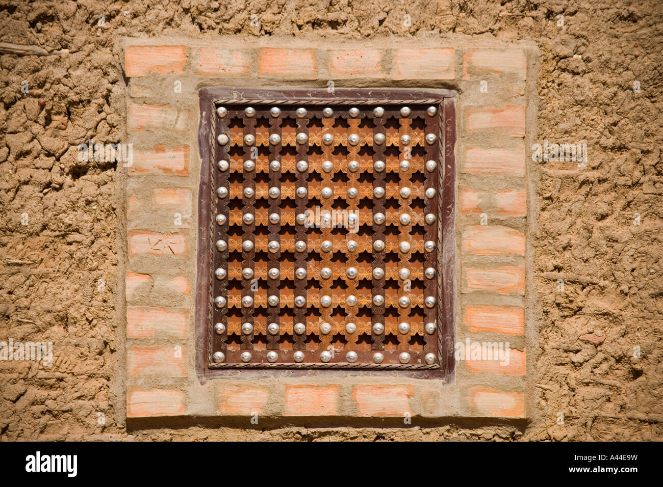 Adobe building and grilled window in Djenne, Mali, West Africa Stock ...