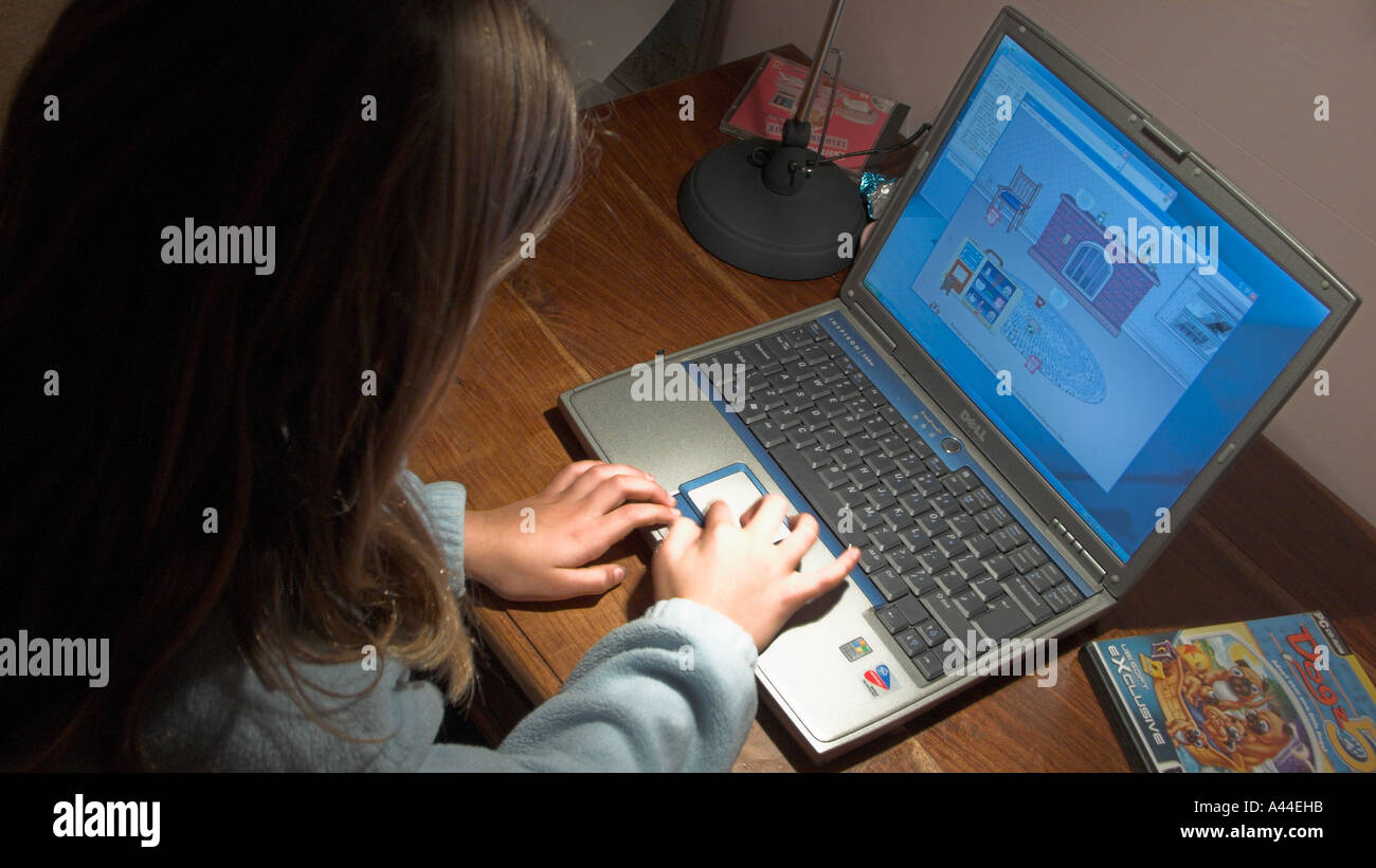 girl child working with laptop computer Stock Photo - Alamy