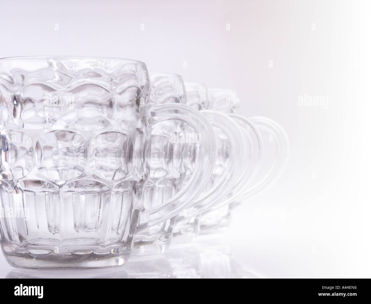 Lineup of empty pub mugs Stock Photo - Alamy