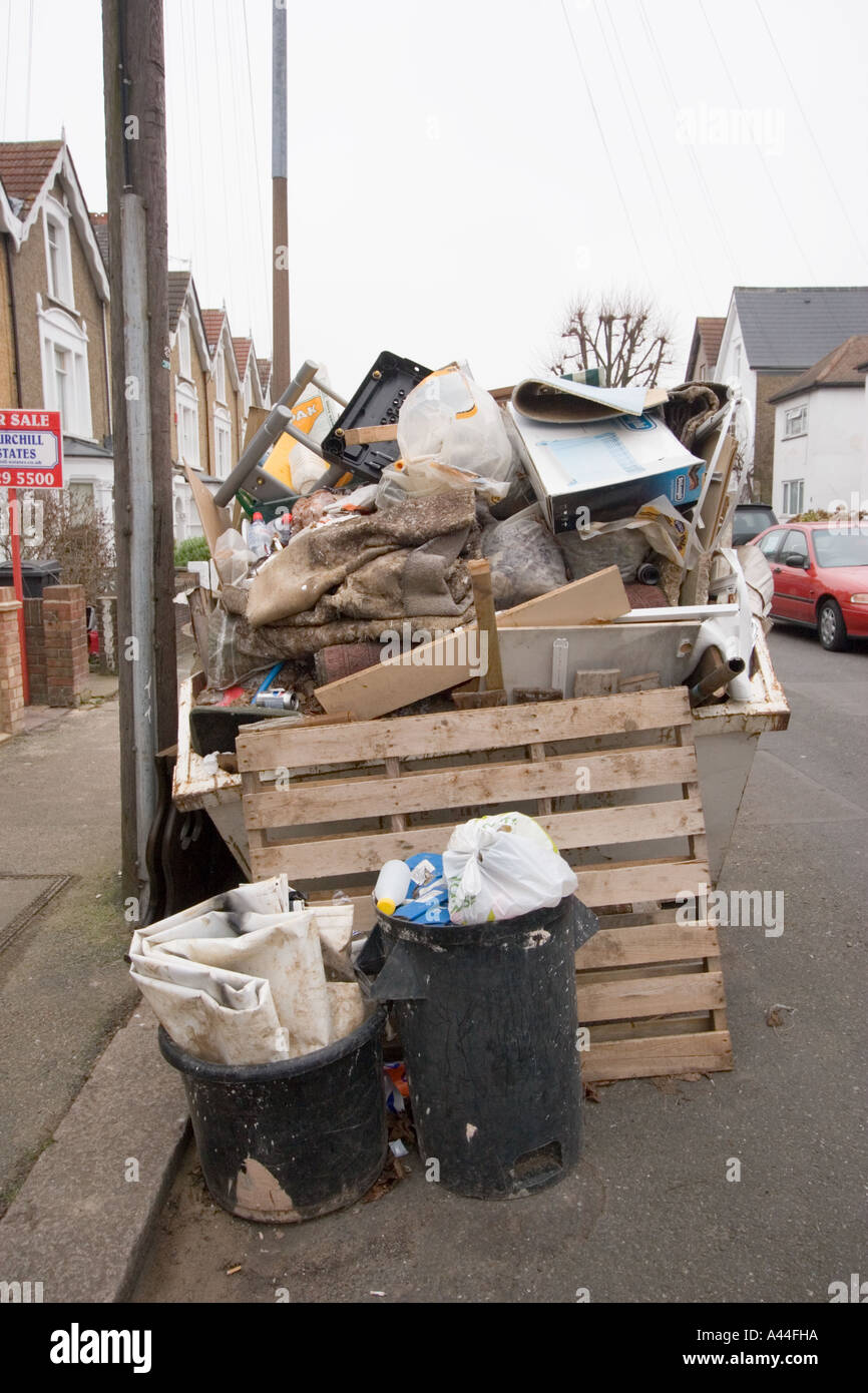 Overloaded skip in road hi-res stock photography and images - Alamy