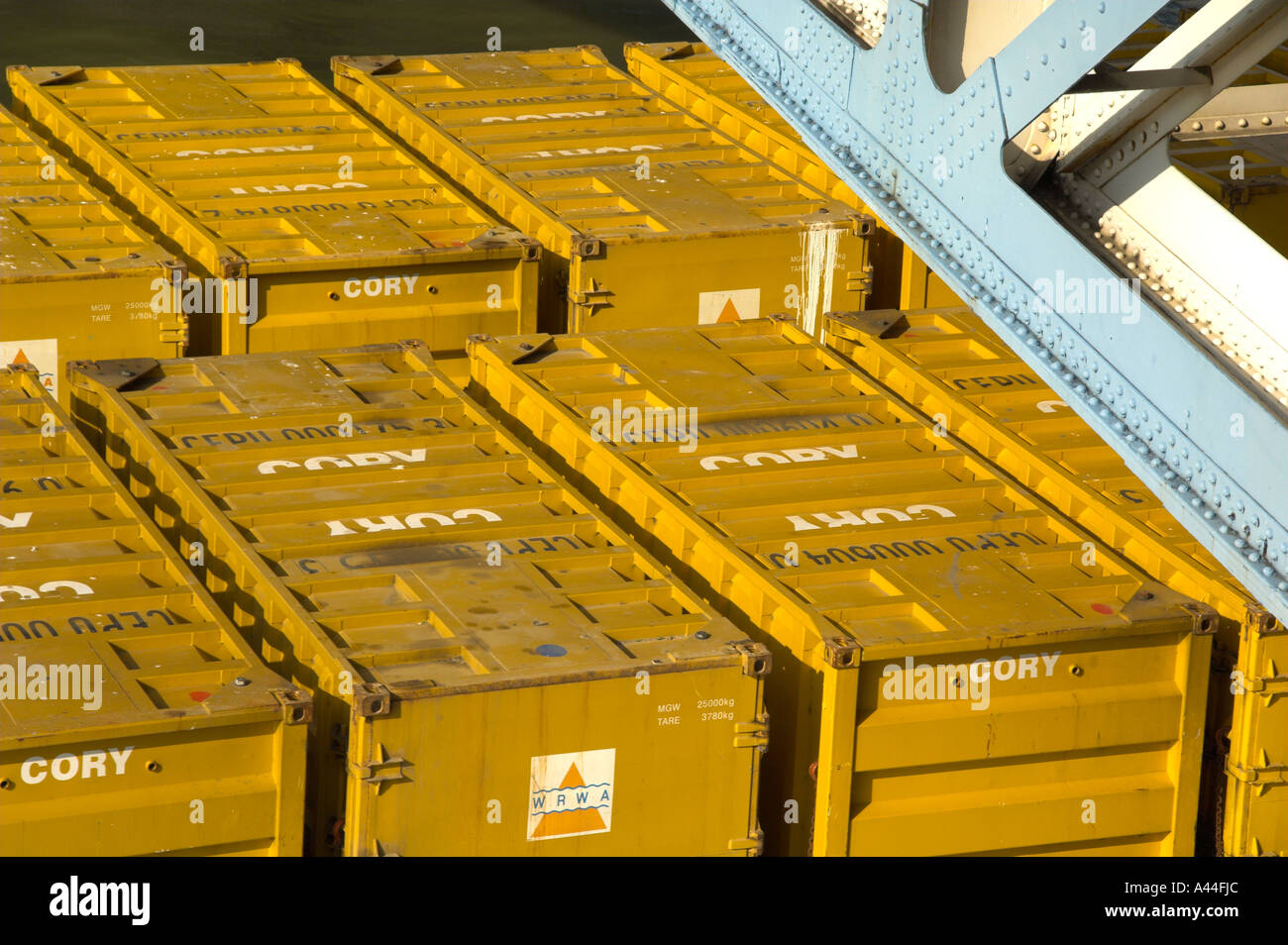 UK England London shipping containers on a barge on the river thames ...