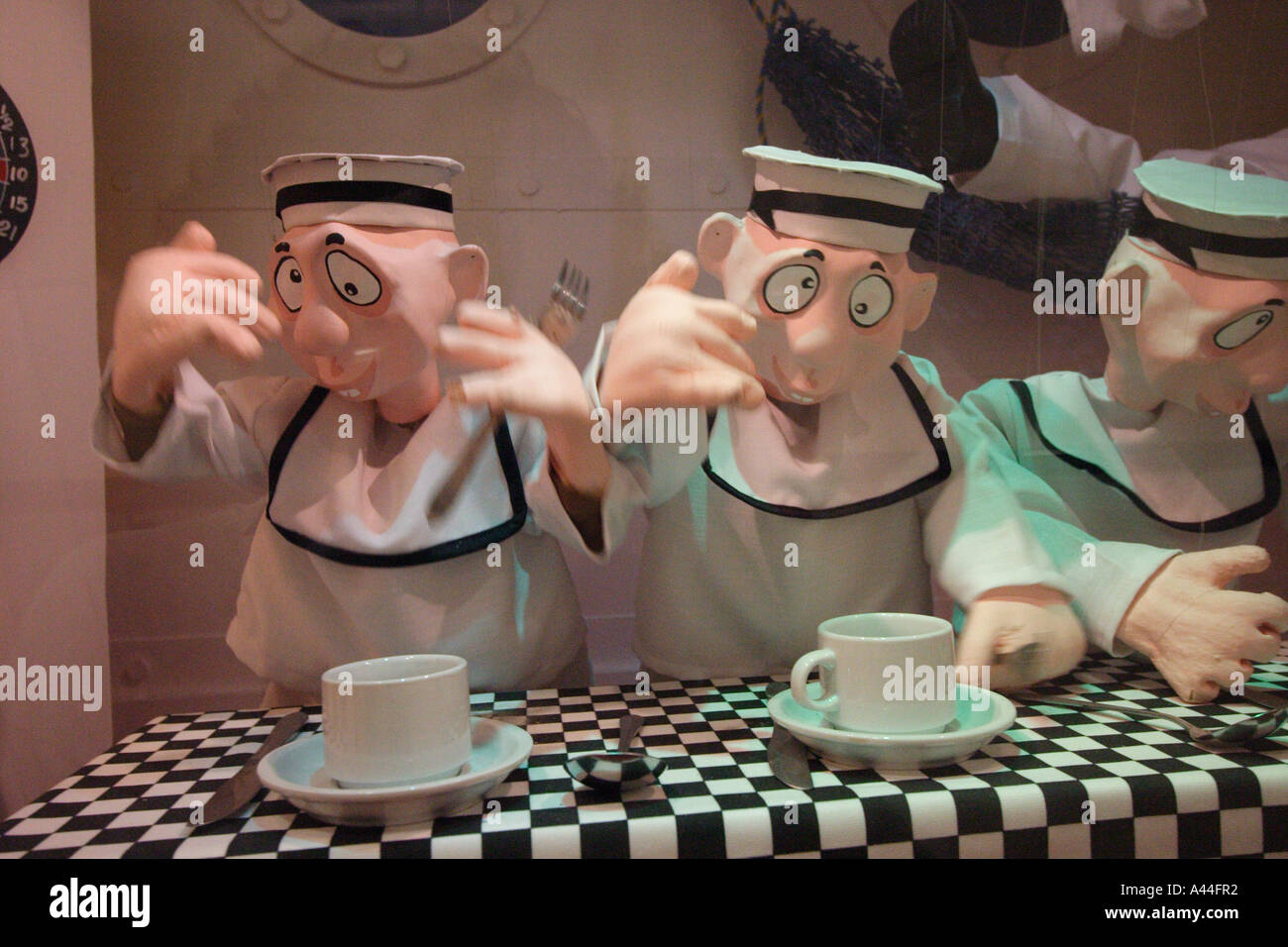 THREE CARTOON SAILORS EATING AT A TABLE HORIZONTAL Stock Photo - Alamy