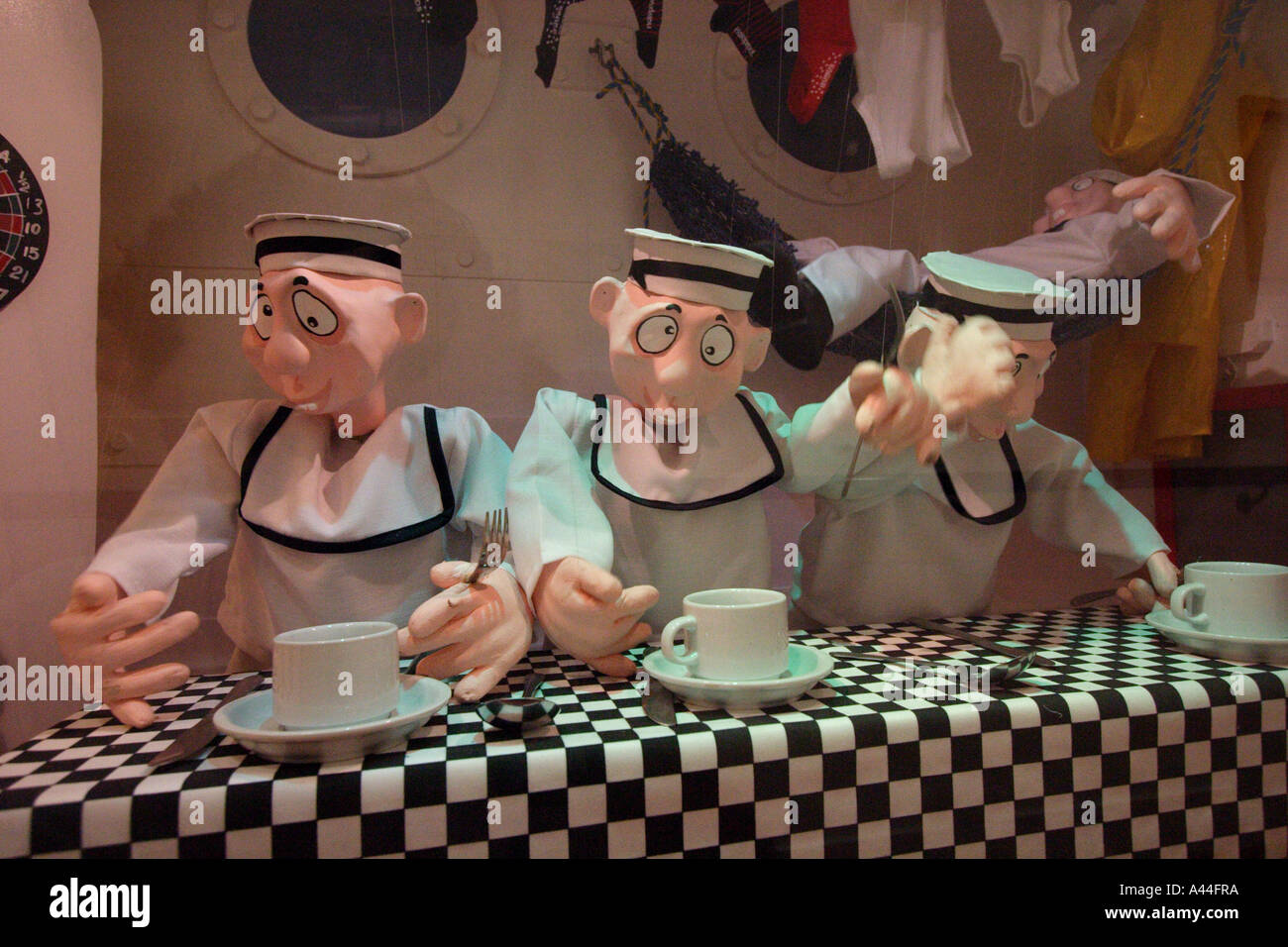 THREE CARTOON SAILORS EATING AT A TABLE HORIZONTAL Stock Photo - Alamy