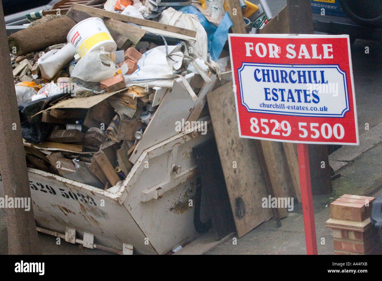 Overloaded skip in road hi-res stock photography and images - Alamy