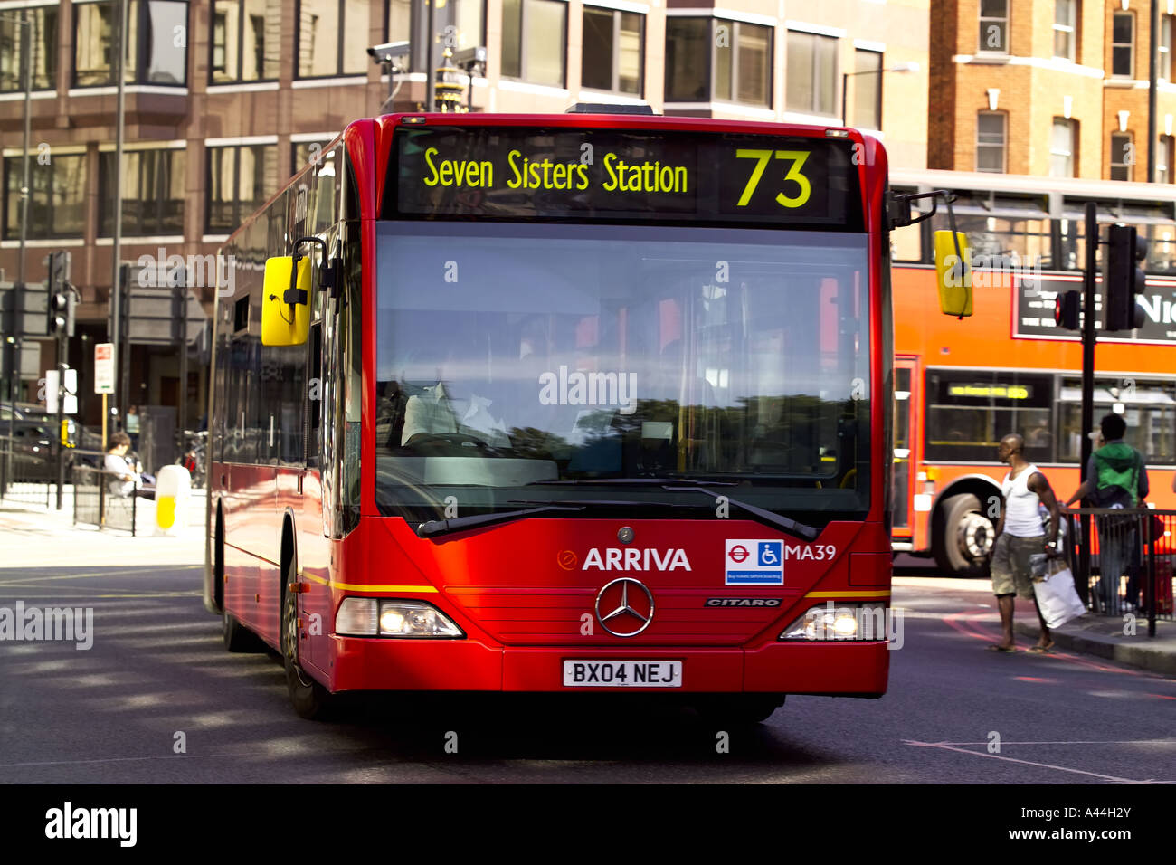 London single decker bus with passengers approaching Victoria Railway ...