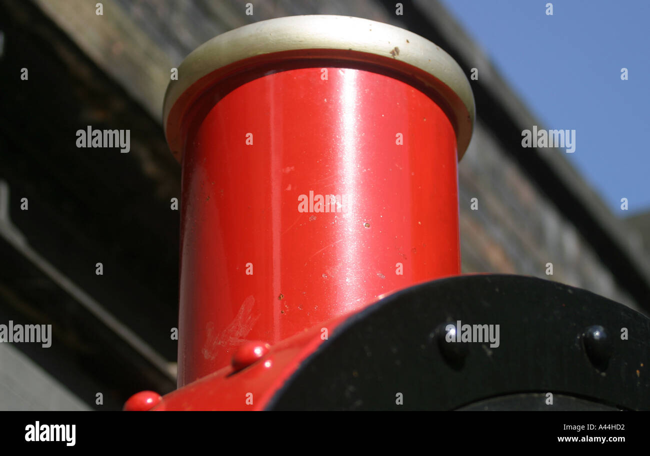 A train coming out of a tunnel The shell of an old steam train has been ...