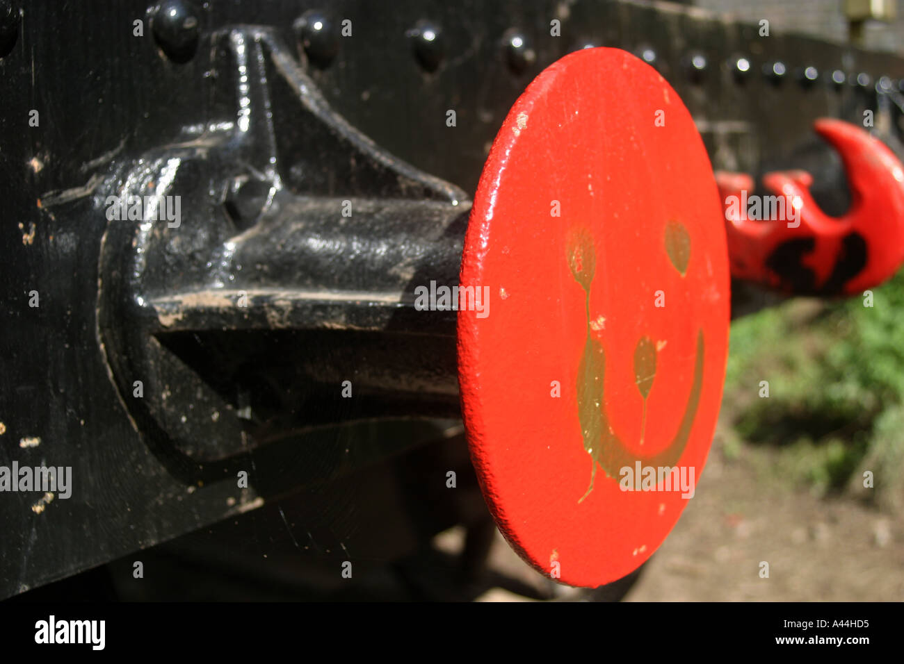 A train coming out of a tunnel The shell of an old steam train has been ...