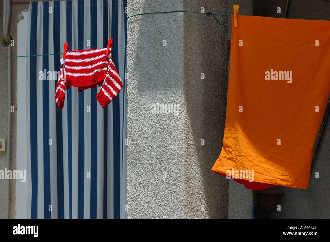 Brightly colored washing on a clothes line Stock Photo - Alamy