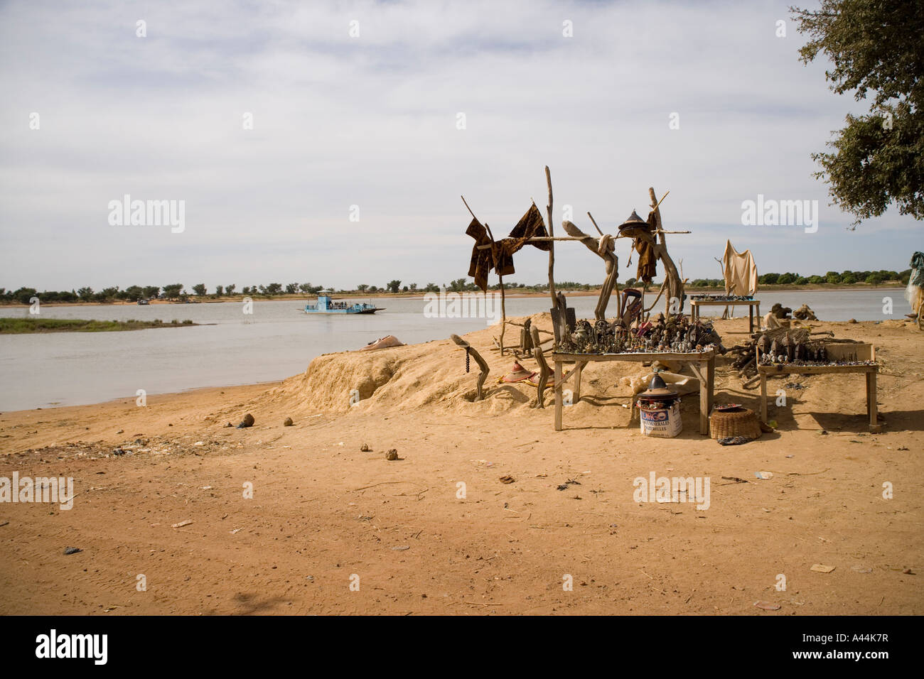 Trinket stall and the ferry to cross the Bani river on route to the ...