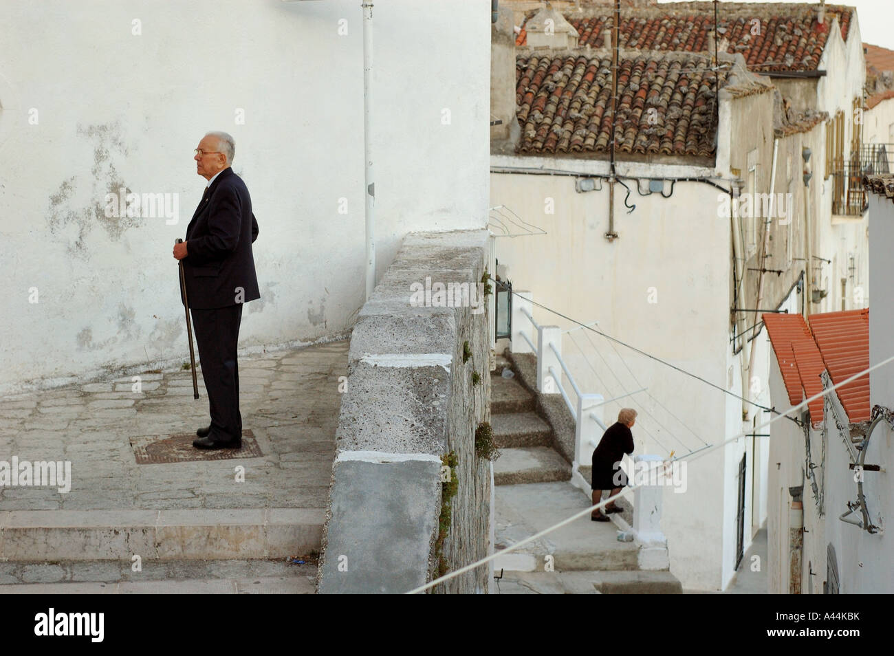 Old man and woman in a small Italian city Stock Photo - Alamy