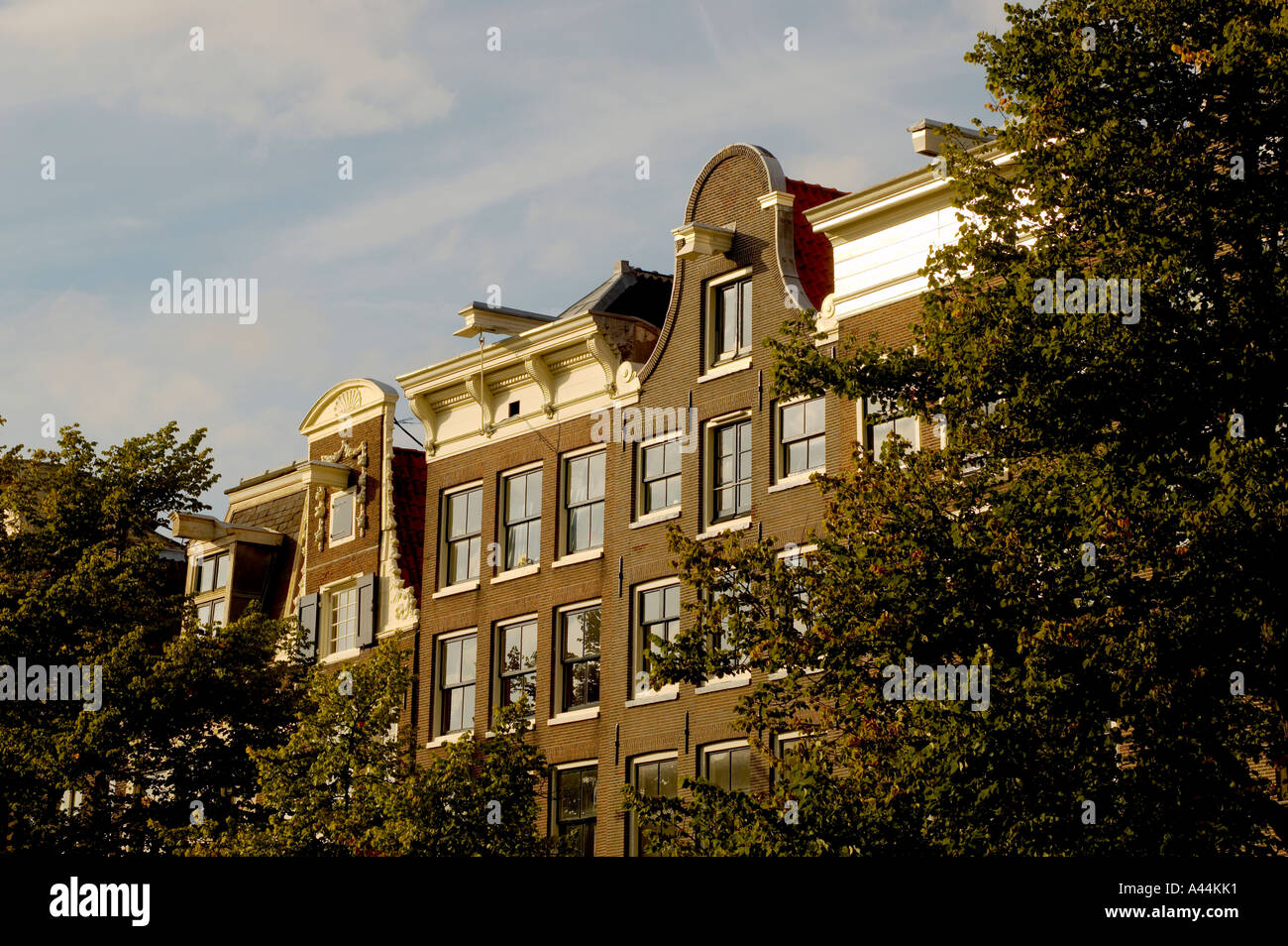 Traditional canal houses, one with a neck gable and another with a bell ...