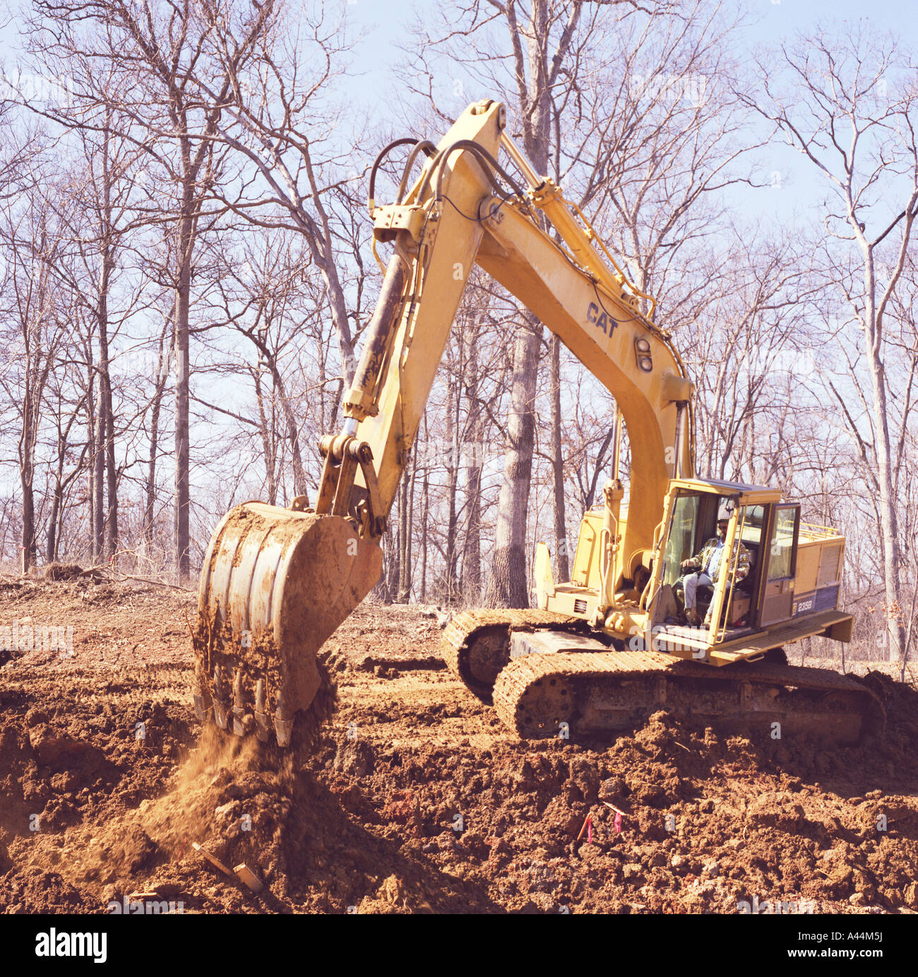 track excavator moving fill dirt Stock Photo - Alamy