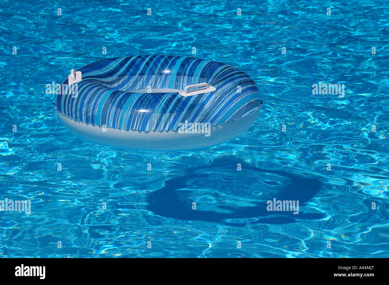 An inflatable tube floating in a swimming pool Stock Photo - Alamy