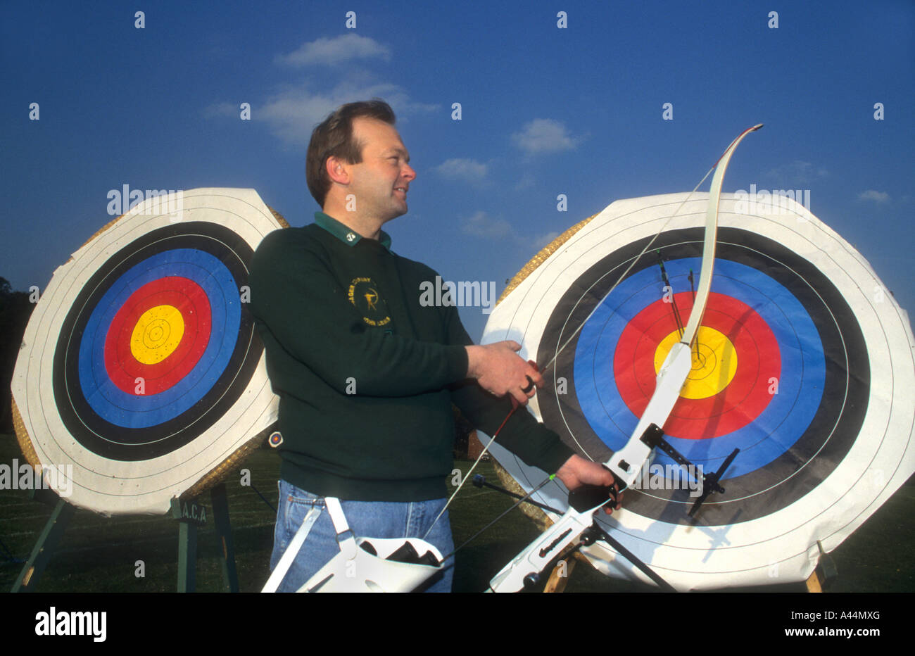 Profile Of An Archer,Standing Infront Of Colourful Circular Targets ...