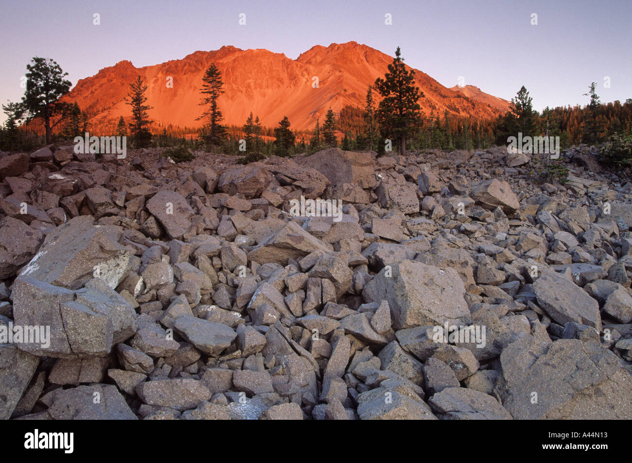 Sunset colors the cliffs of Chaos Crags above the rocks known as Chaos ...