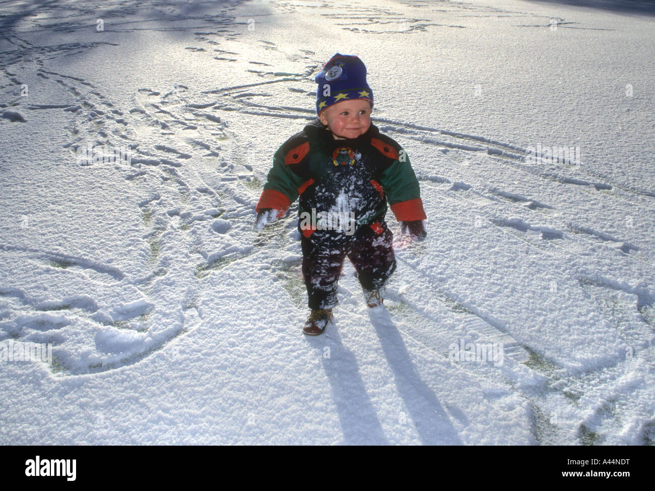 Happy Little Boy ,Exploring Snow For The First Time Stock Photo - Alamy