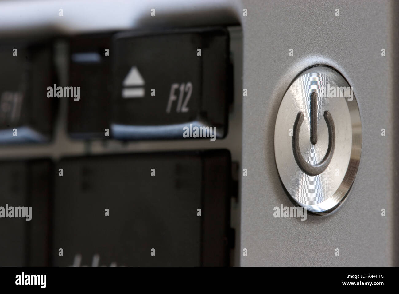 Power switch on a modern sleek laptop computer Stock Photo - Alamy