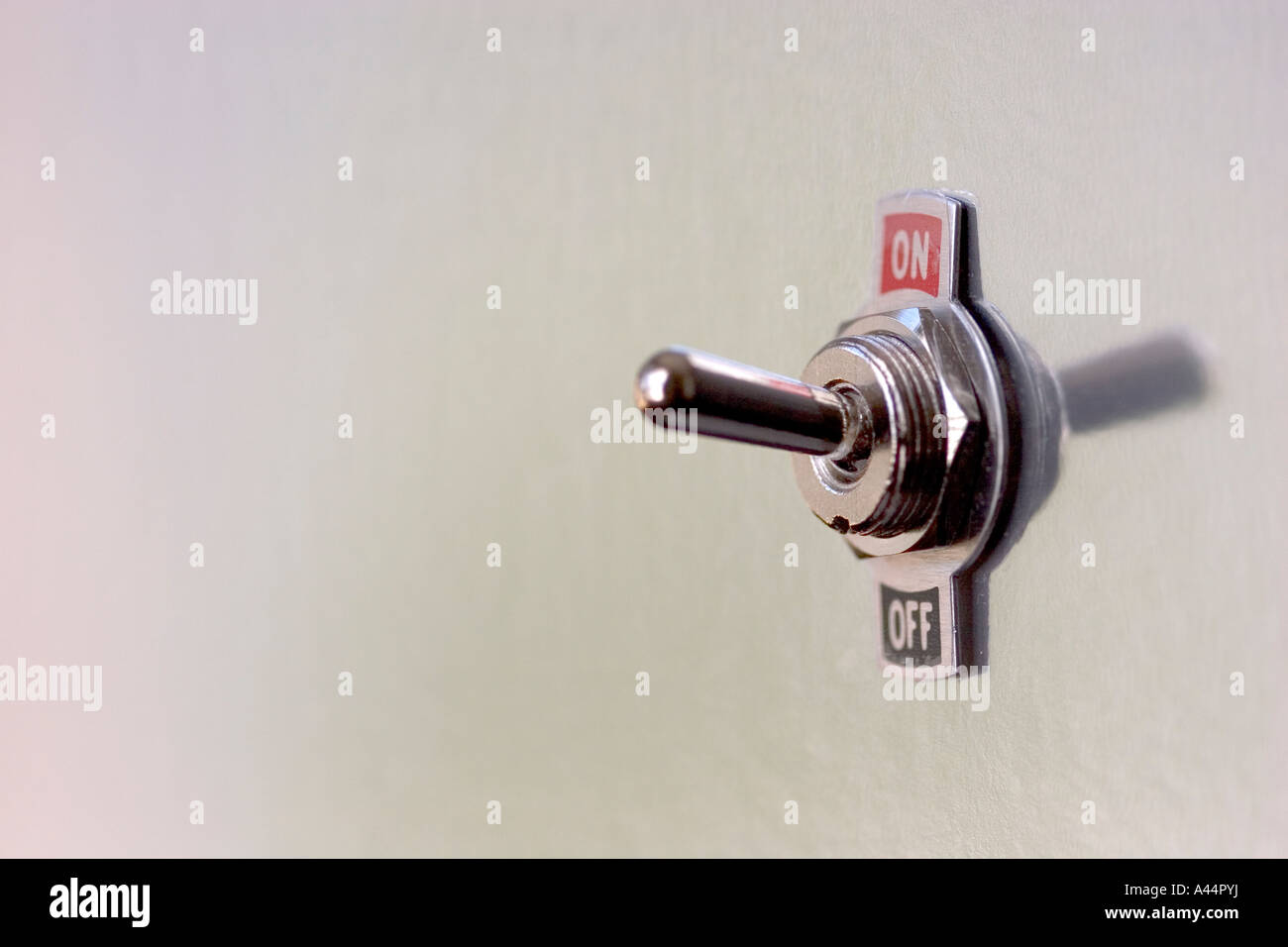 Abstract graphic image of an electric toggle switch on a shiny silver ...