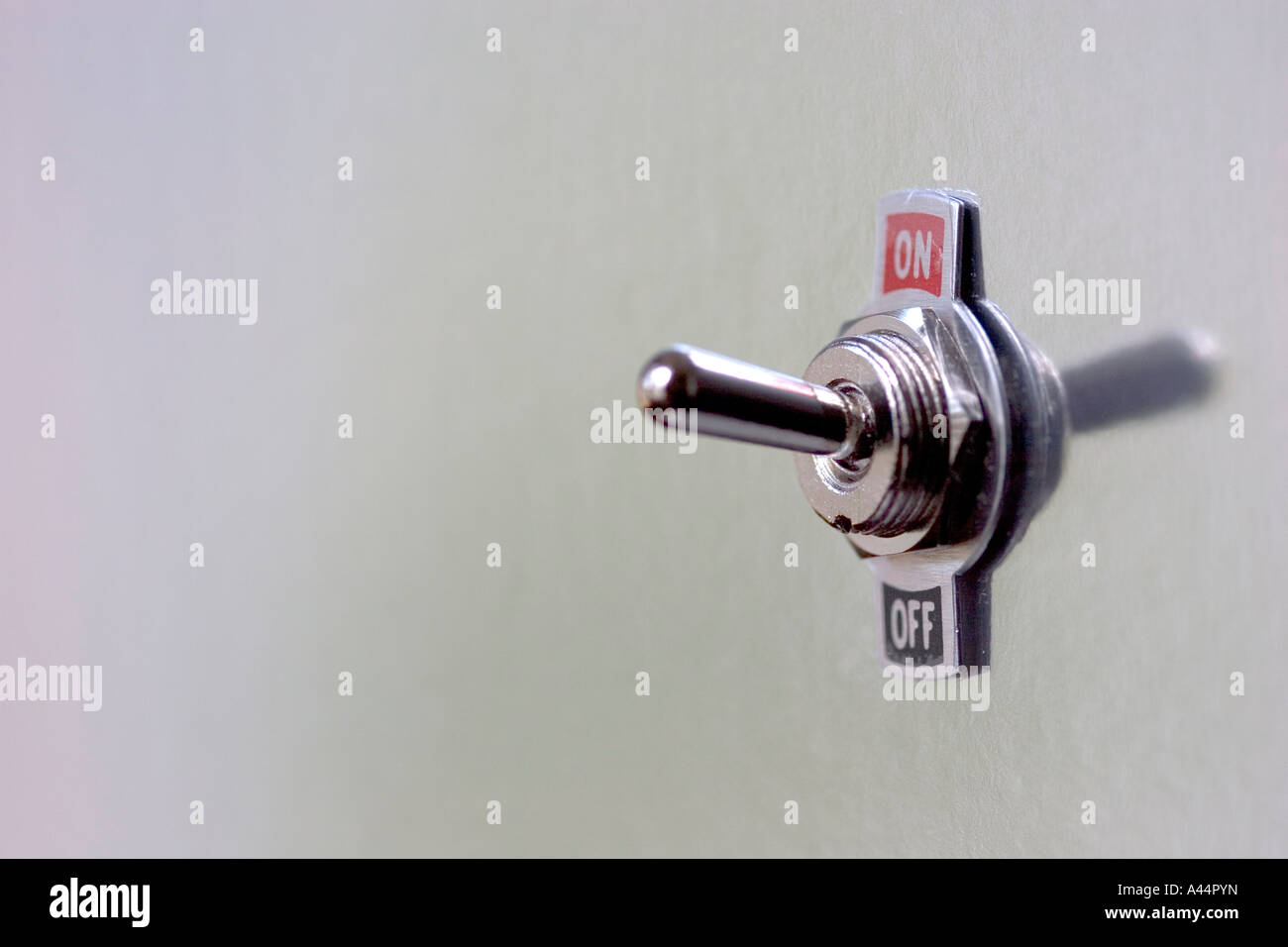 Abstract graphic image of an electric toggle switch on a shiny silver ...