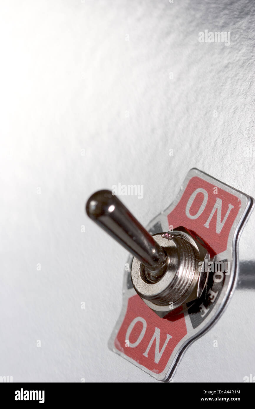 Abstract graphic image of an electric toggle switch on a shiny silver ...