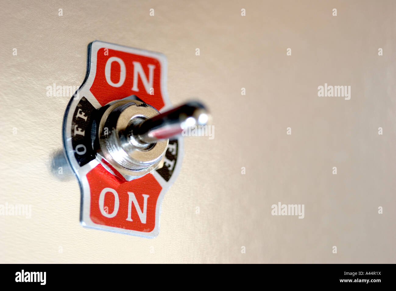 Abstract graphic image of an electric toggle switch on a shiny silver ...