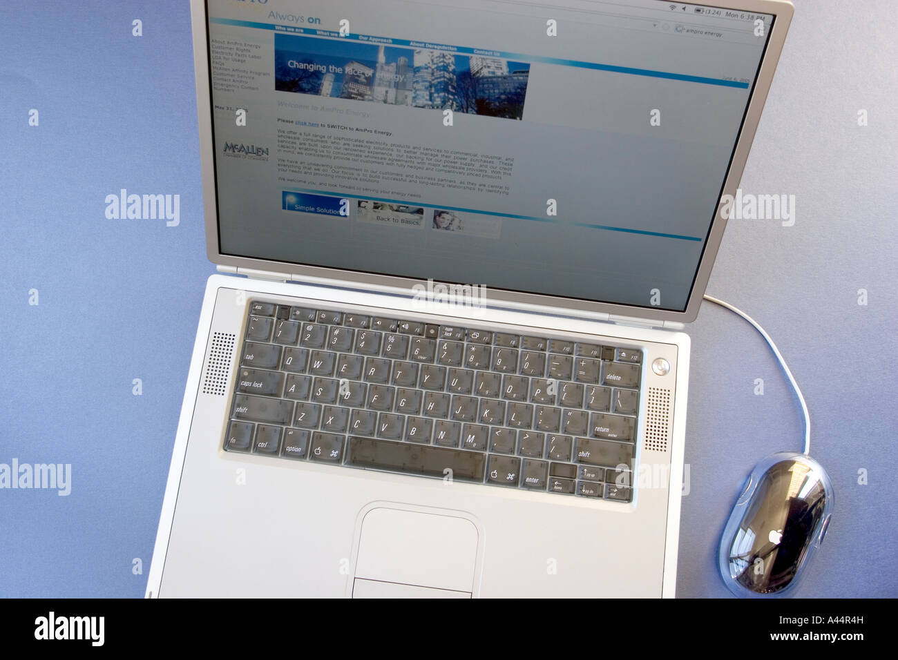 Silver laptop computer on blue background Stock Photo - Alamy