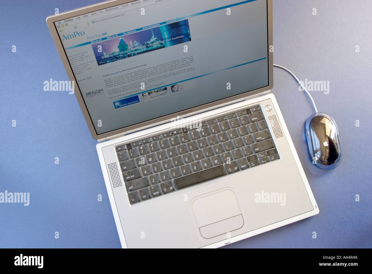 Silver laptop computer on blue background Stock Photo - Alamy