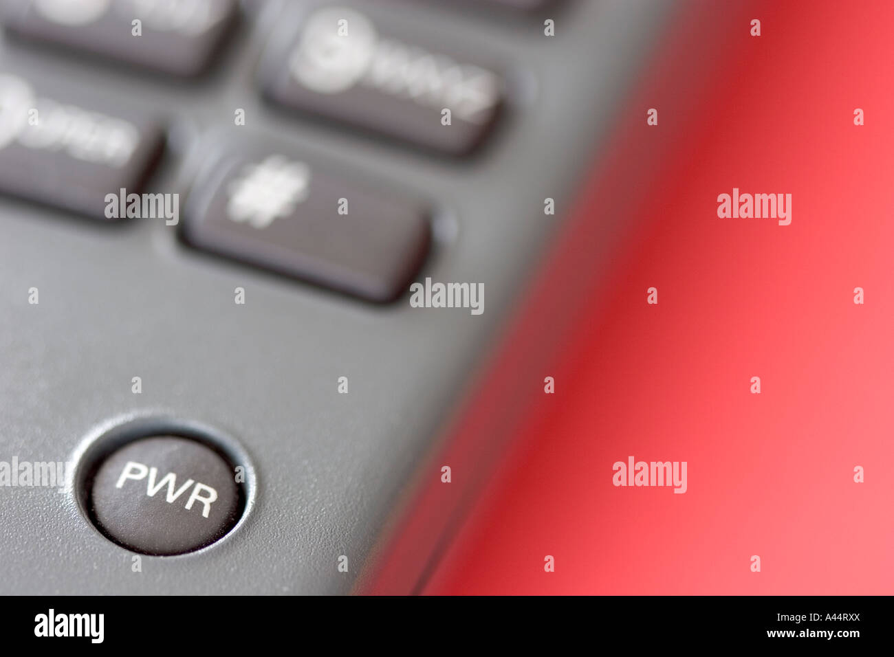 Closeup of power switch on sleek modern digital cordless phone on ...