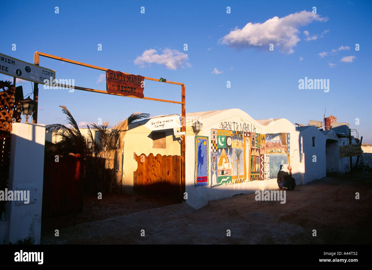 street in Dahab Sinai Egypt with colorful mural and entrance to holiday ...