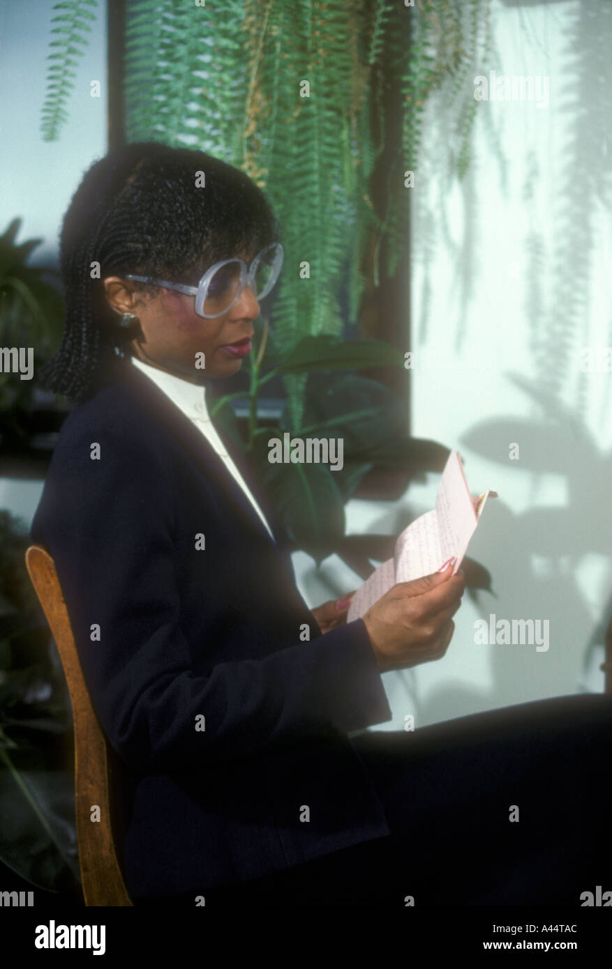 Woman reading large paper hi-res stock photography and images - Alamy