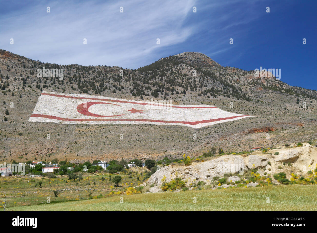 The Turkish Republic of Northern Cyprus flag on the hillside above ...