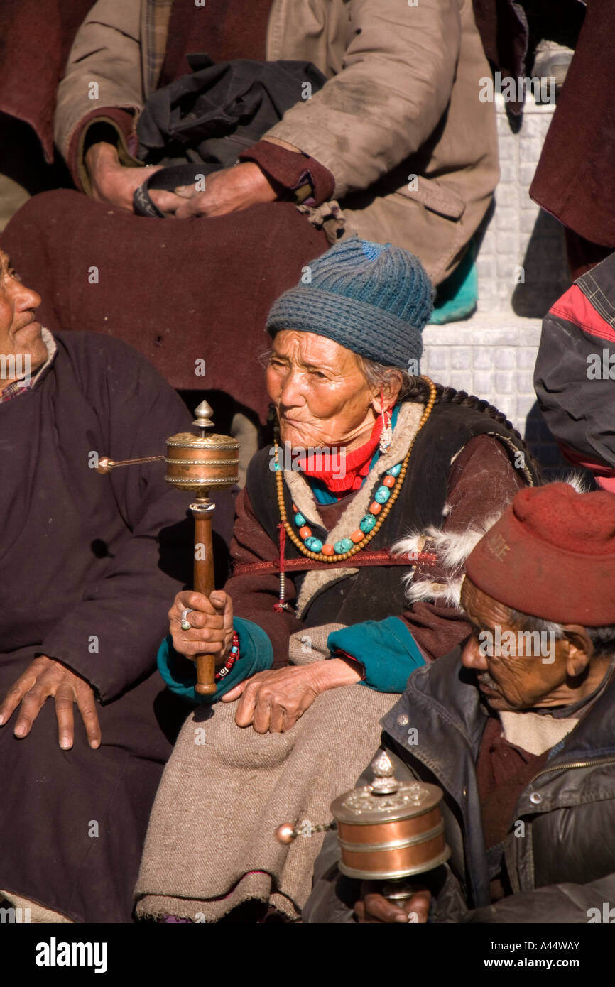 India Ladakh Leh Spitok Festival old Ladakhi woman spinning prayer ...