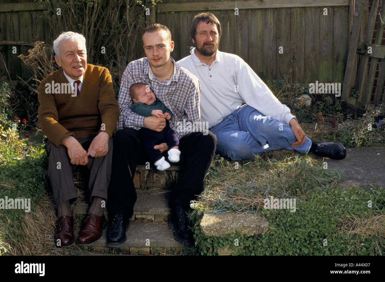 four generations of men in one family sitting in garden in luton ...
