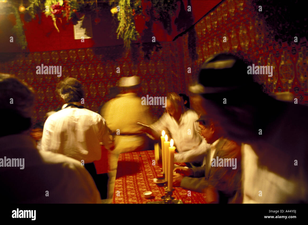 Jewish crowd pray inside a Suca in the Sucot festival in Bukhara ...