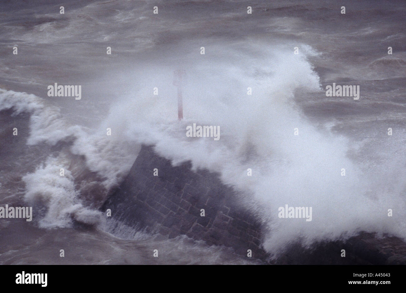 Waves crash over a seawall hi-res stock photography and images - Alamy