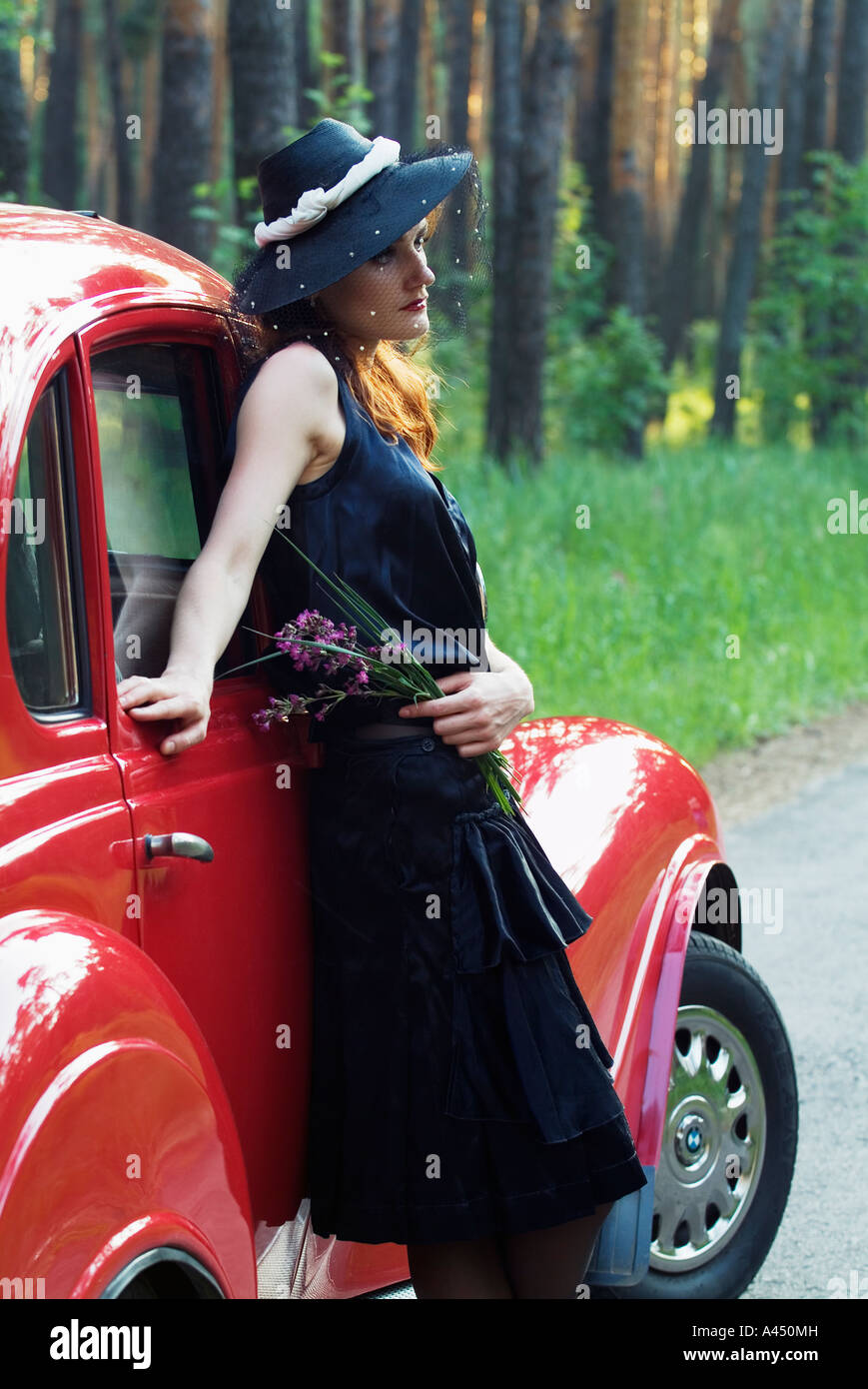 Woman with antique car Stock Photo - Alamy