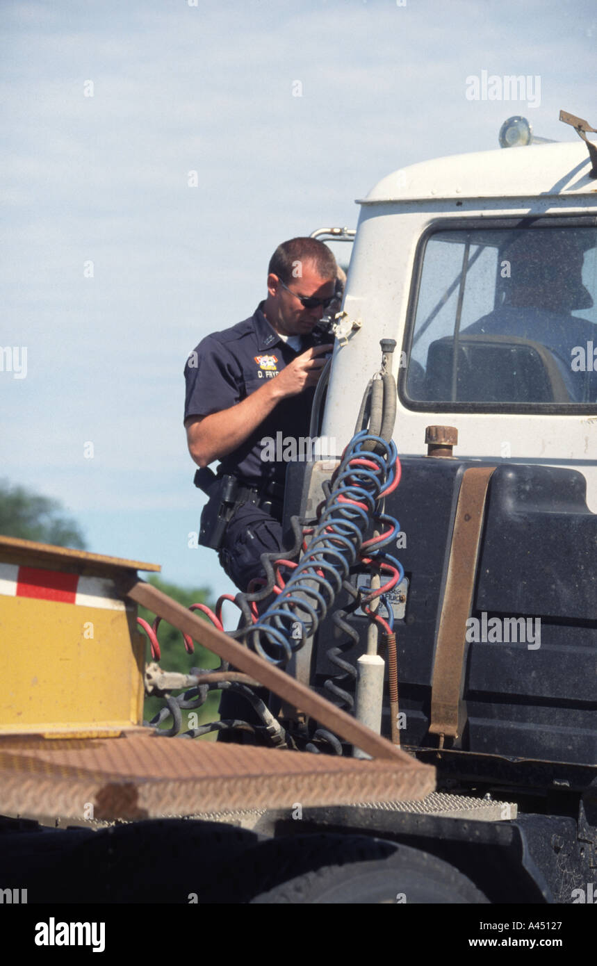 Police officer writing a traffic ticket Stock Photo - Alamy