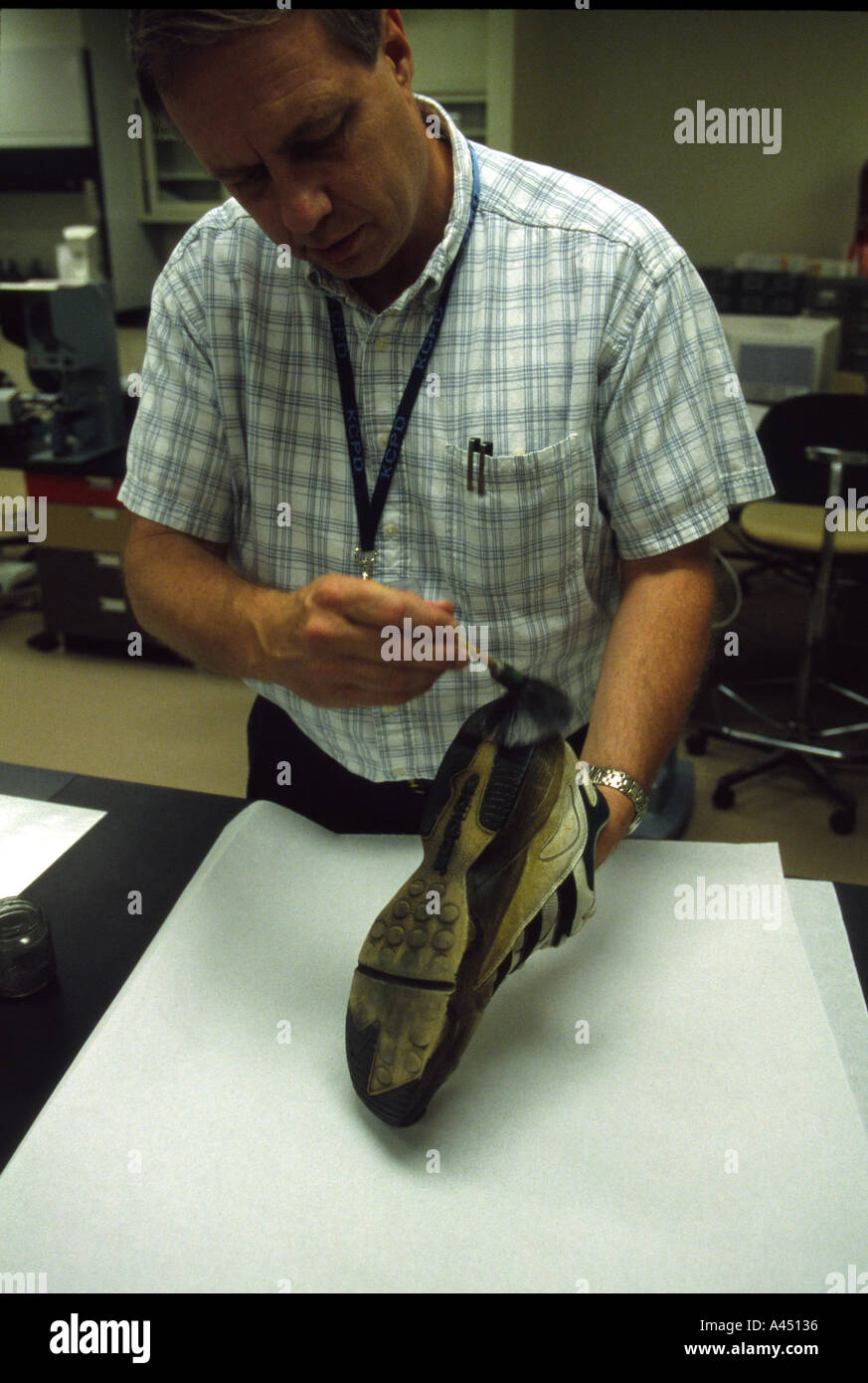 Forensics expert making a shoe imprint Stock Photo - Alamy