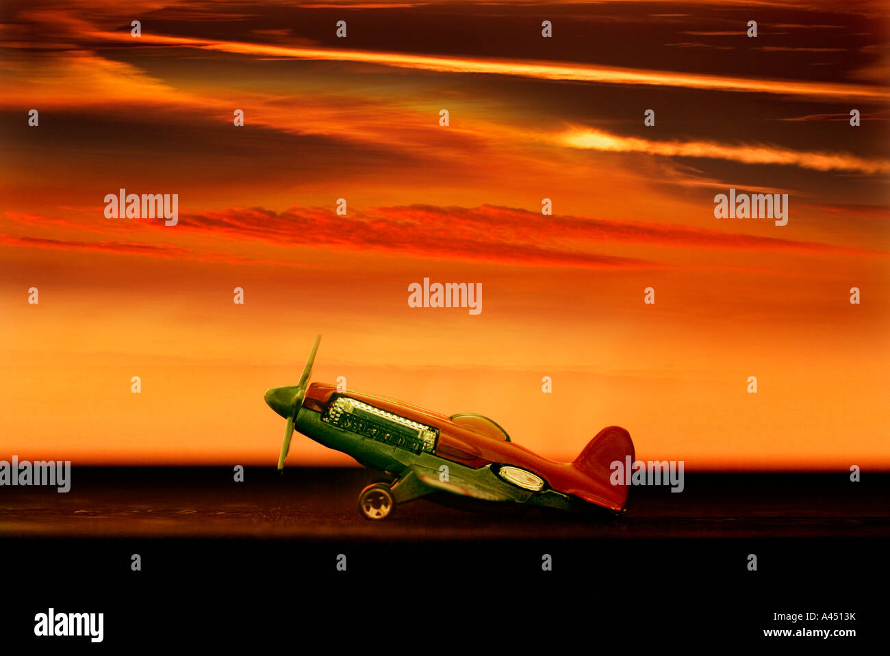 Airplane at sunset Stock Photo - Alamy