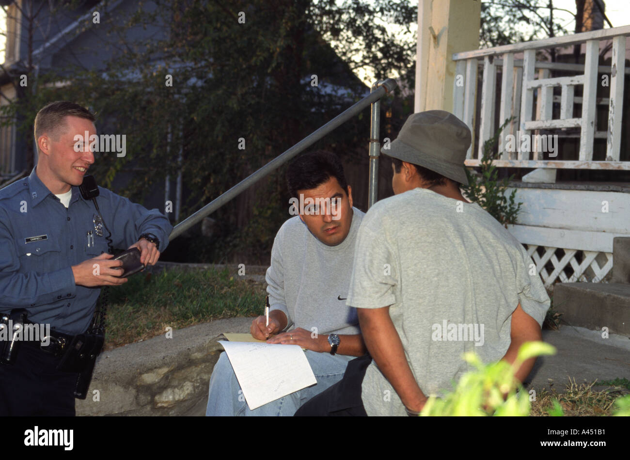 Arrest officers talking arrested gang hi-res stock photography and ...