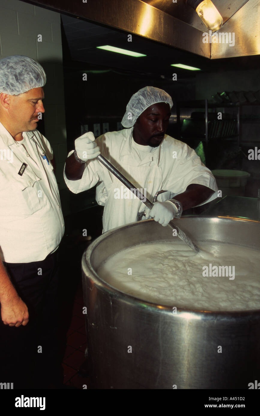 Inmate working in the kitchen. Correctional Officer supervising ...