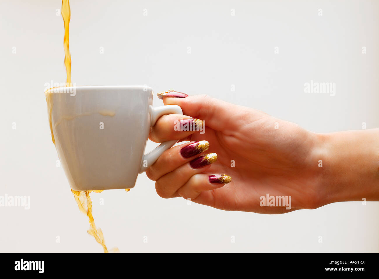 Woman catching a cup of coffee Stock Photo - Alamy
