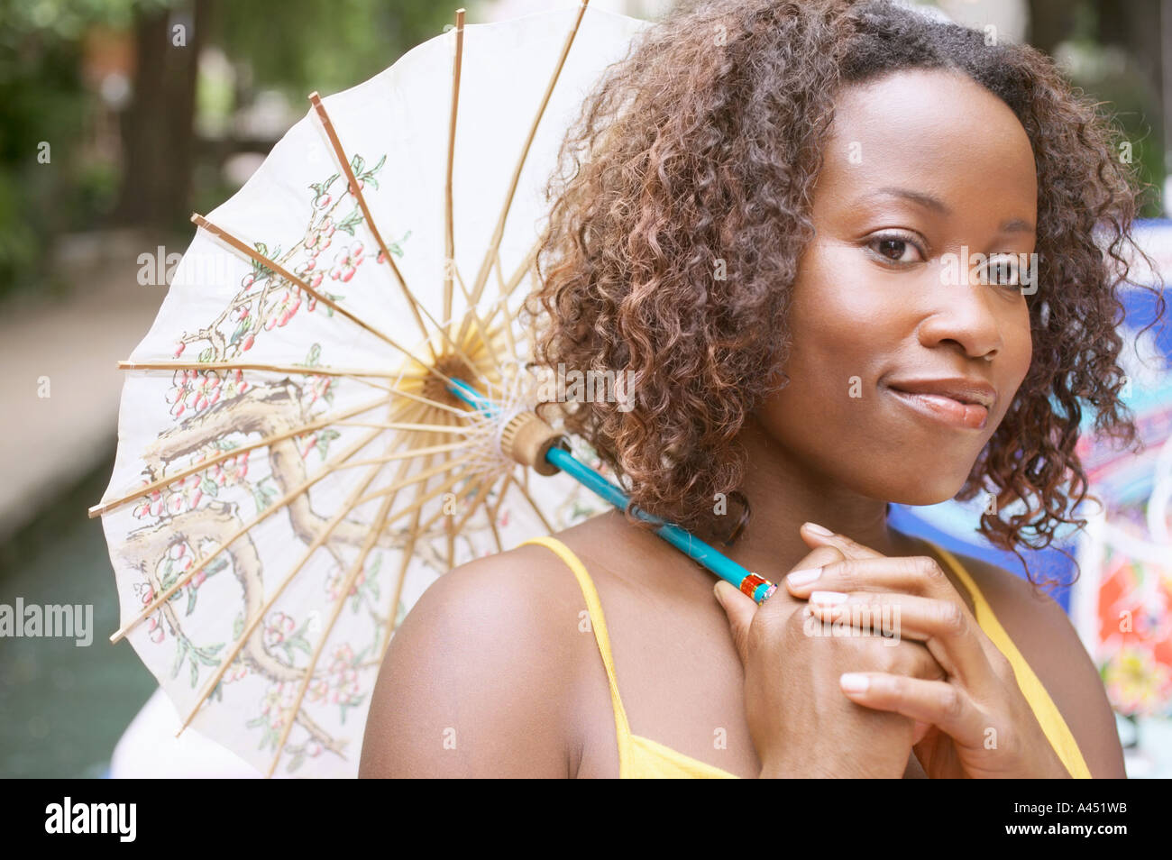 Woman holding a parasol outdoors Stock Photo - Alamy