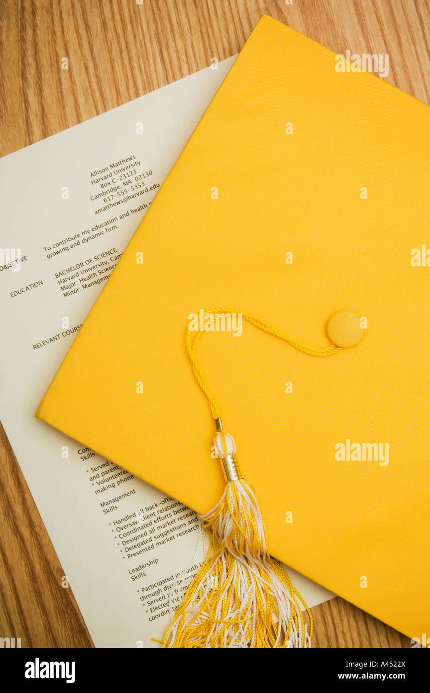 Graduation cap and resume Stock Photo - Alamy
